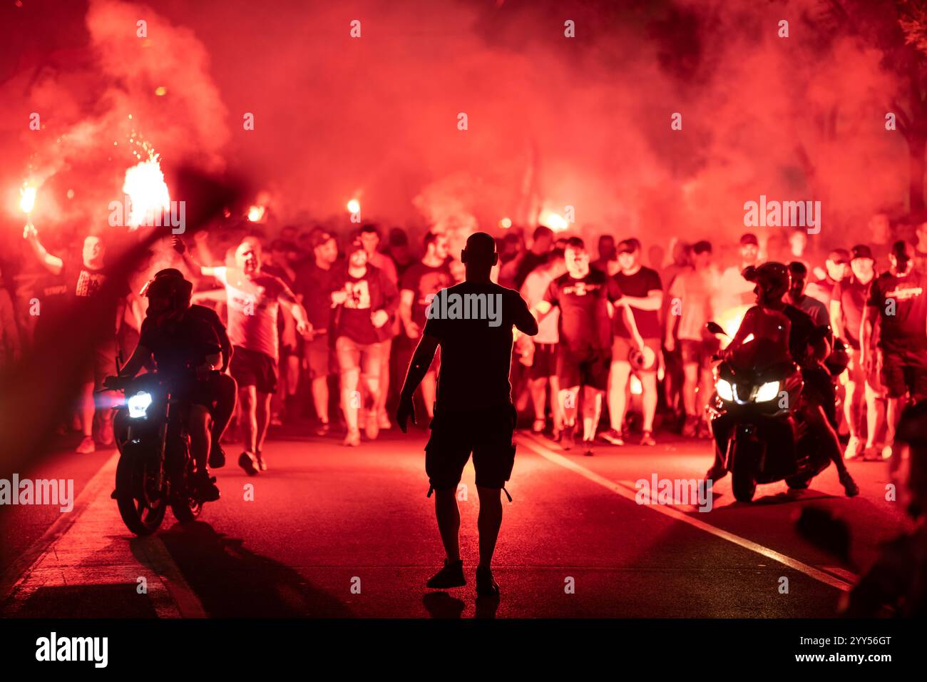 Red Star Football fans with torches and flags marching on streets and ...