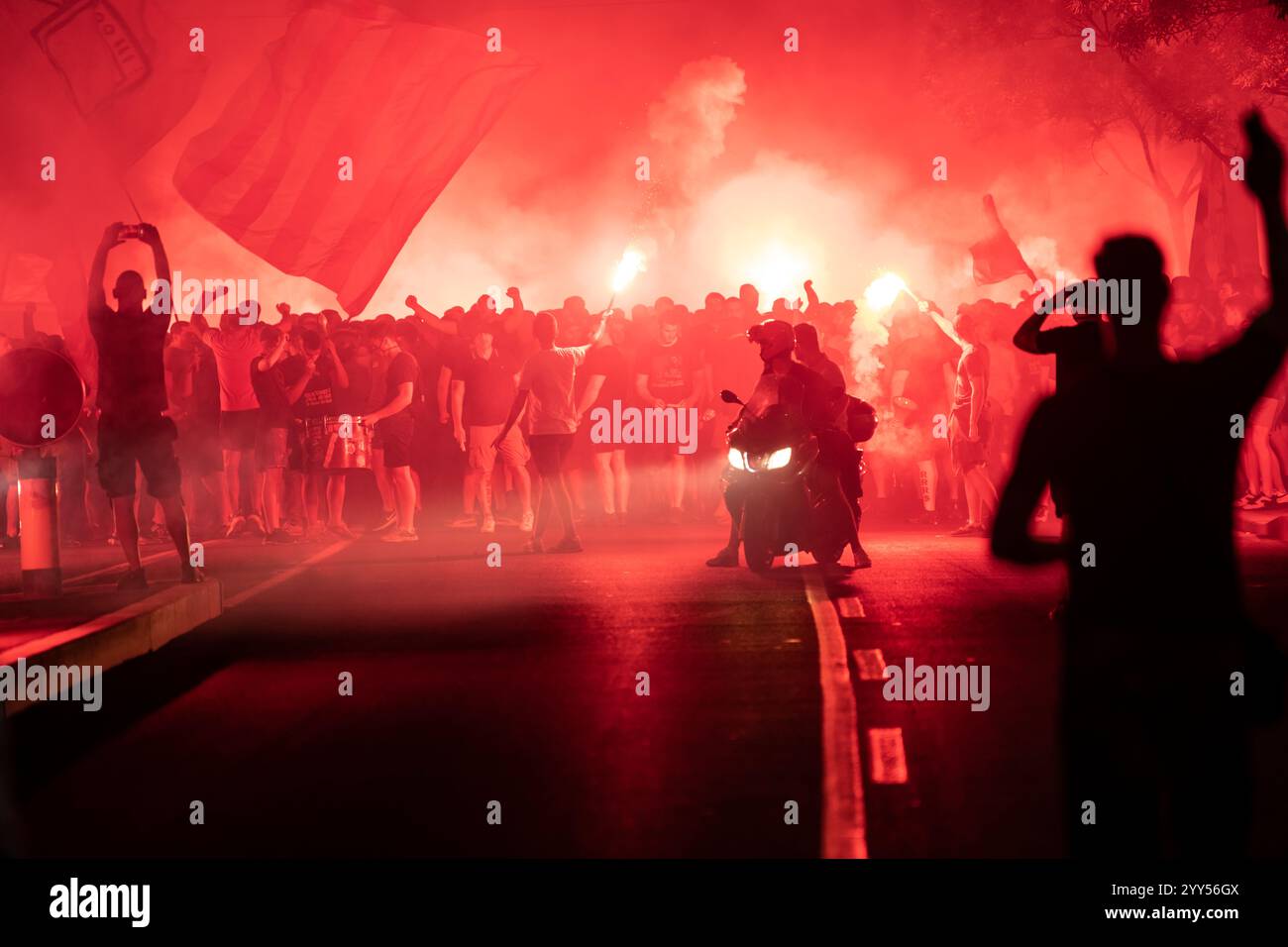 Red Star Football fans with torches and flags marching on streets and ...