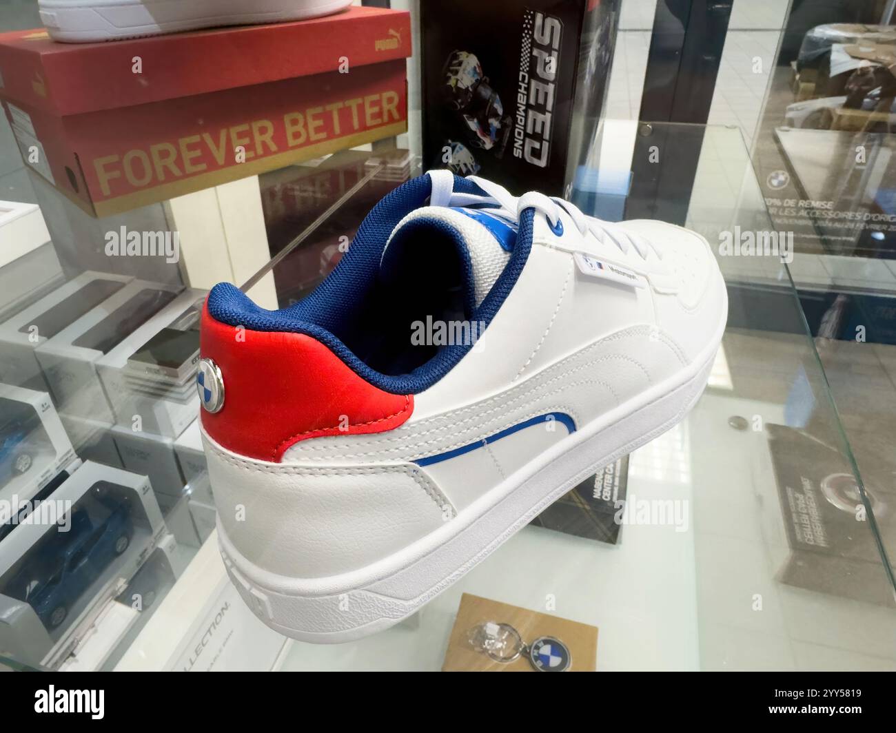 Paris, France - Dec 05, 2024: White BMW sports shoe with blue and red ...