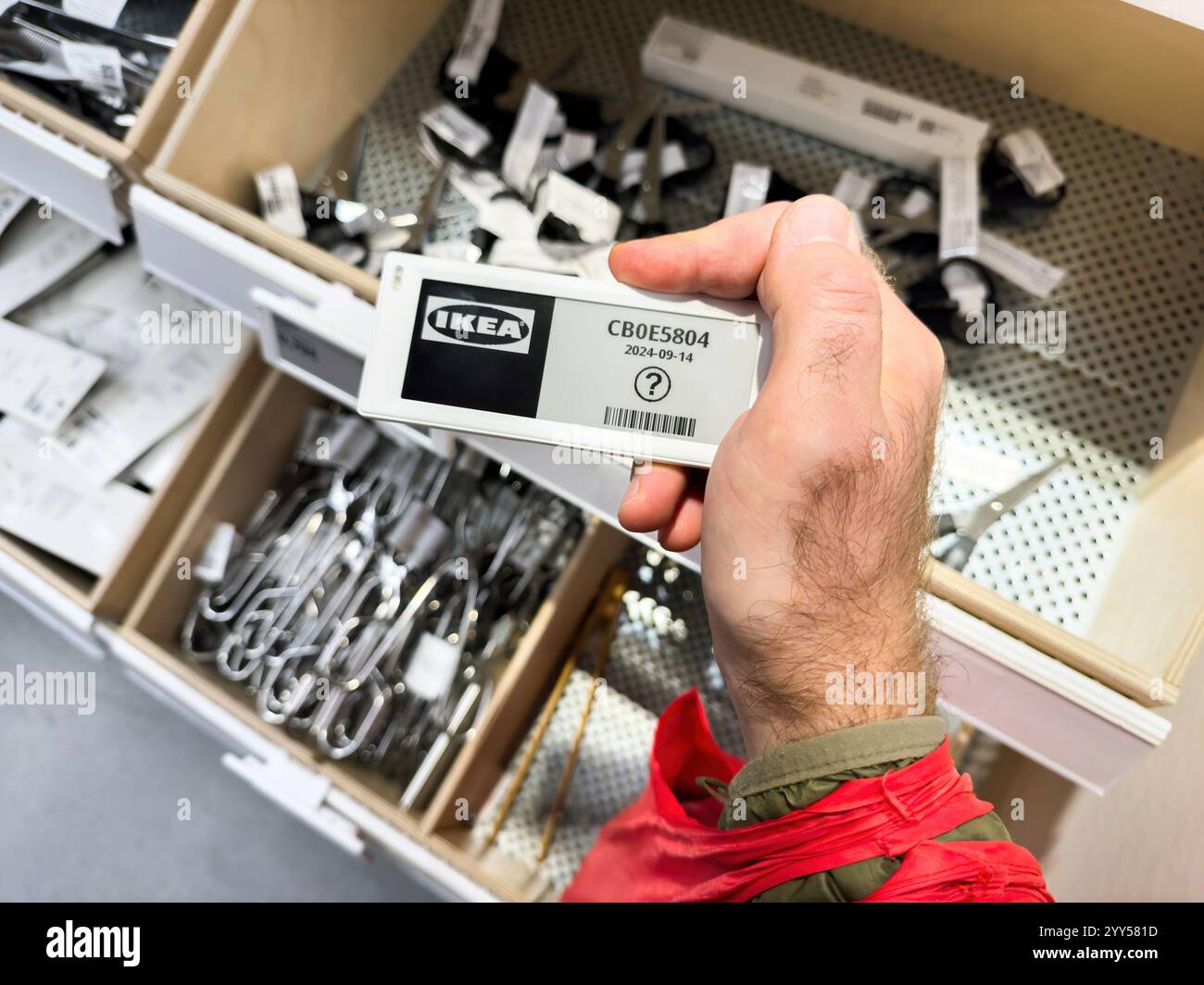 Paris, France - Oct 26, 2024: Male hand holding in IKEA new A close-up ...