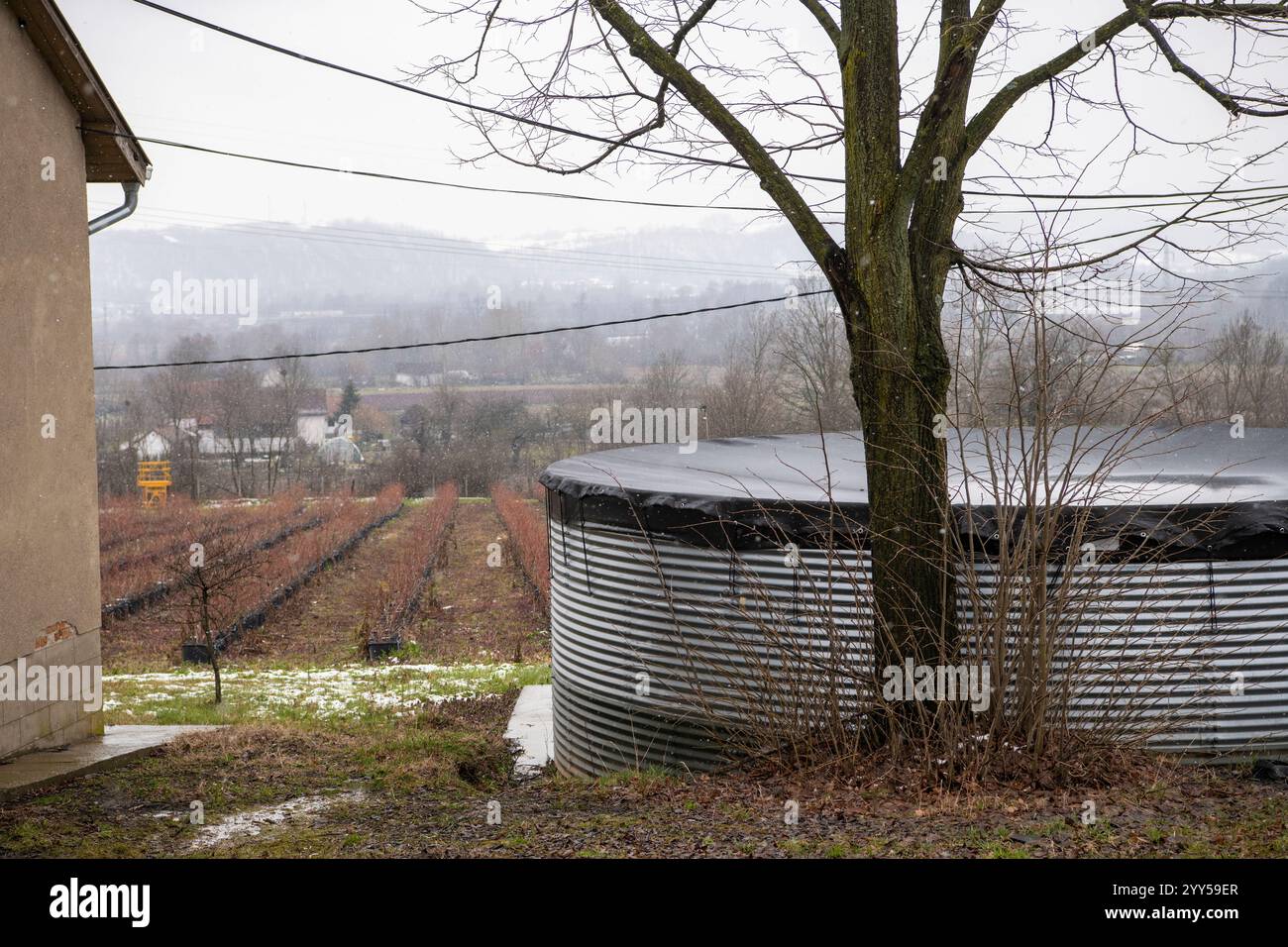 Eco friendly large fresh water metal tank on rural property used to ...