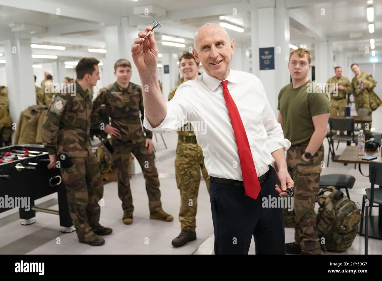 Defence Secretary John Healey playing darts as he meets British ...