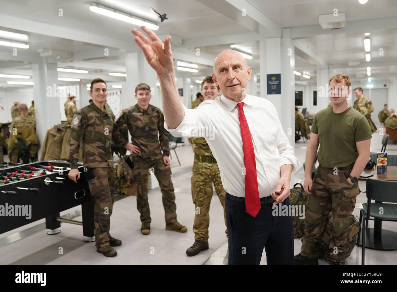 Defence Secretary John Healey playing darts as he meets British ...
