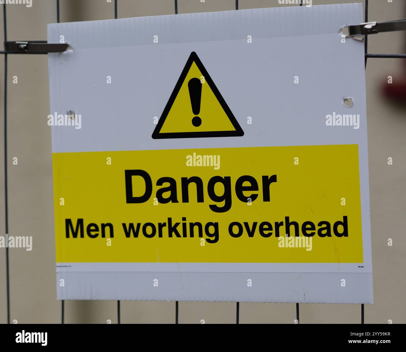 A sign warning about men working overhead Stock Photo - Alamy