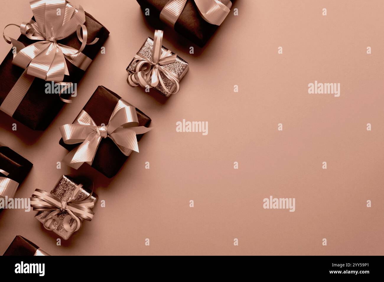 Paper background in mocha mousse color with black gift boxes Stock ...
