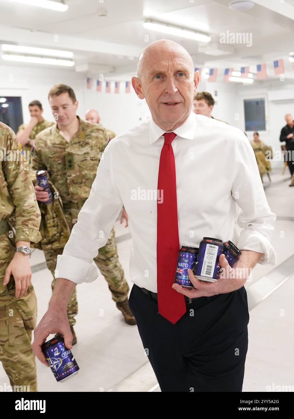 Defence Secretary John Healey giving out cans of drink as he meets ...
