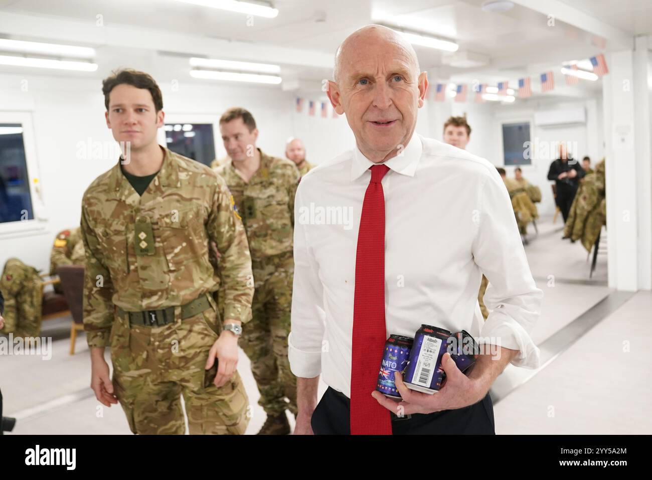 Defence Secretary John Healey giving out cans of drink as he meets ...