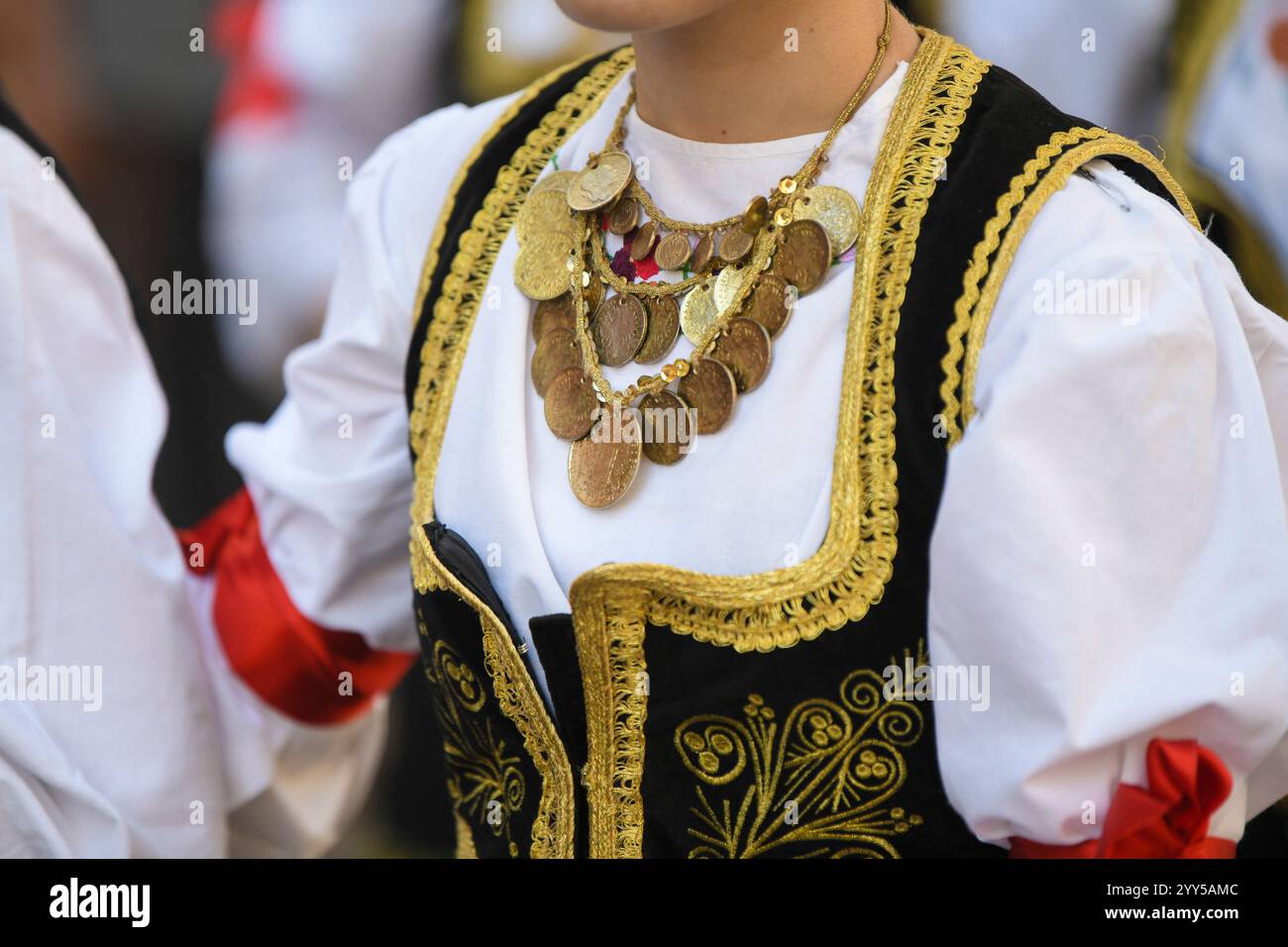 Closeup detail of beautiful necklace and waistcoat of traditional ...