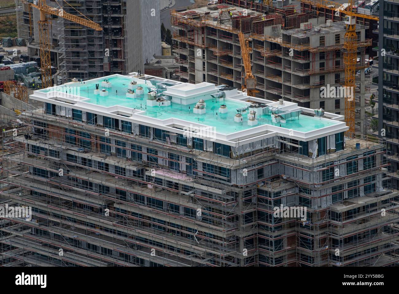 Waterproofing coating on high skyscraper rooftop. Elastomeric liquid ...