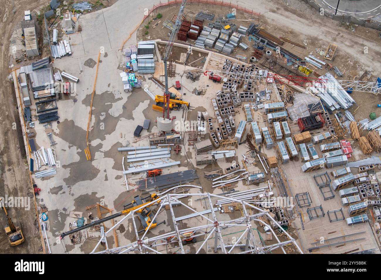 Busy construction site and lots of construction material, equipment ...