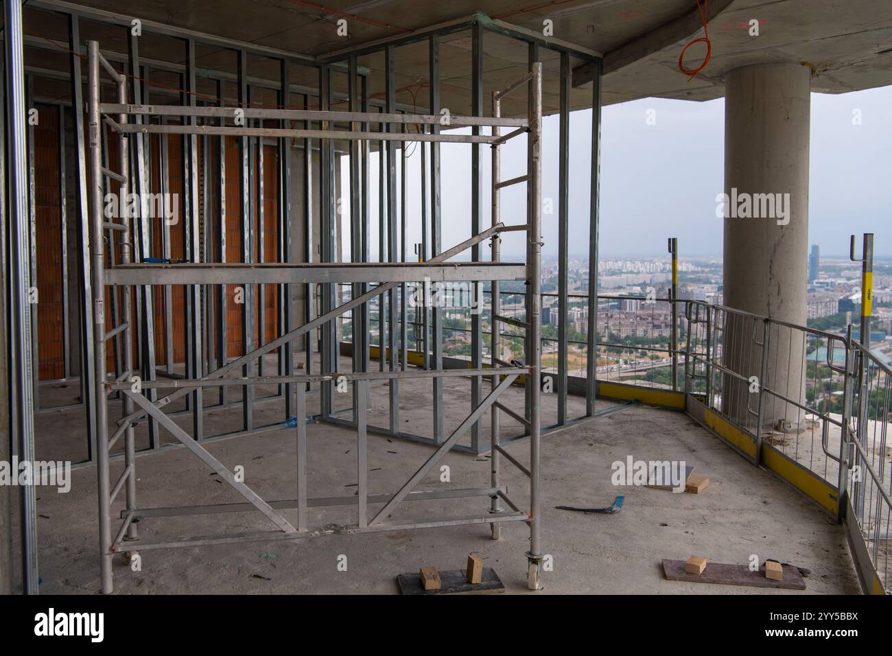interior of skyscraper floor under construction. Cables, pipes and ...