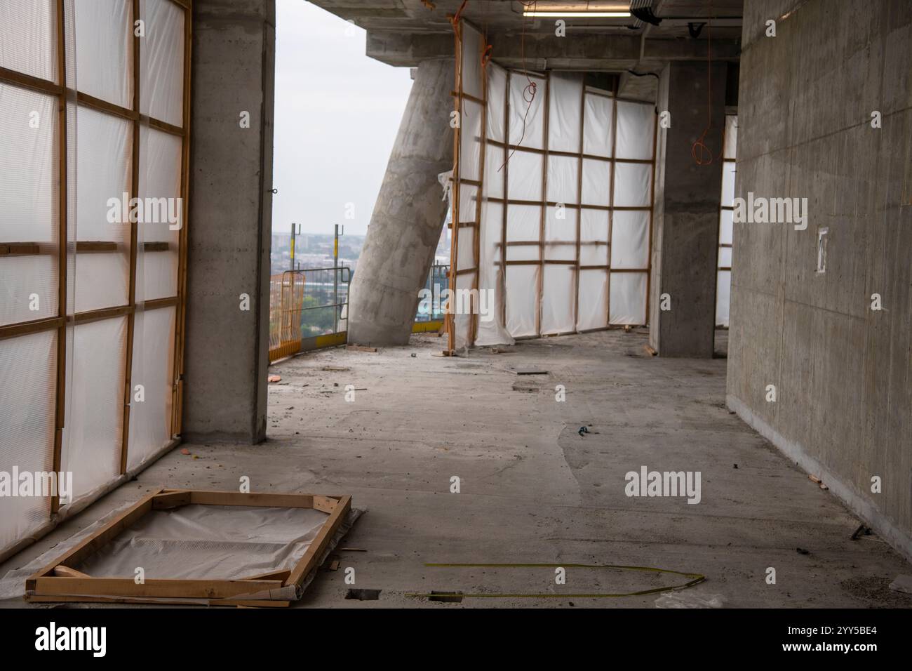 interior of skyscraper floor under construction. Cables, pipes and ...