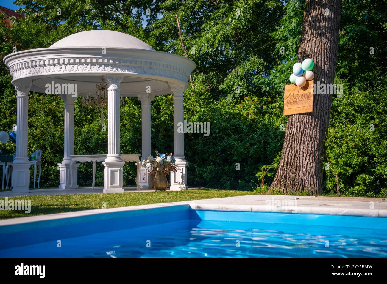 Luxury decoration setup by the pool for event celebration in backyard ...