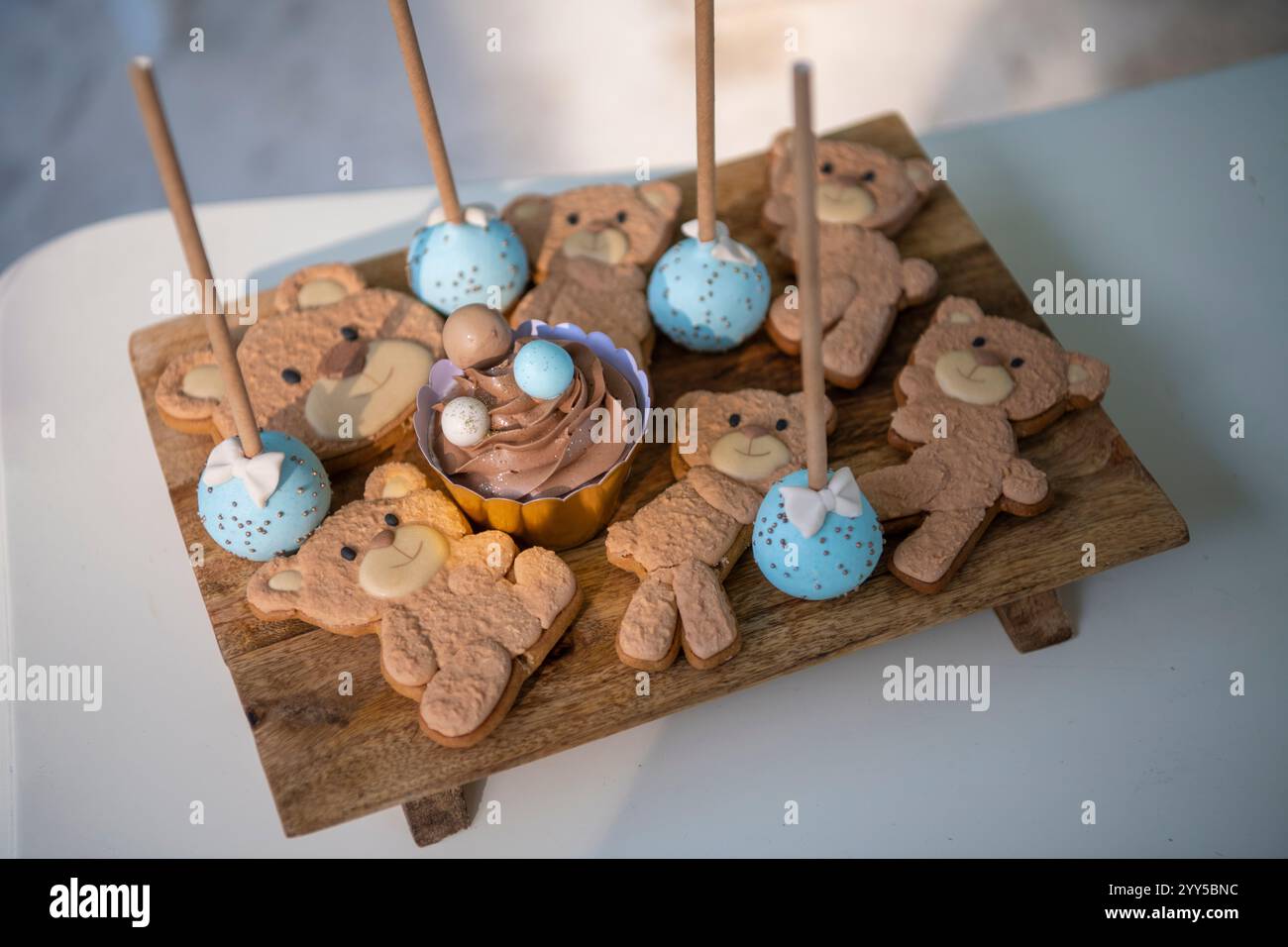 Teddy bear shaped cookies with chocolate, almonds on wooden plate Stock ...