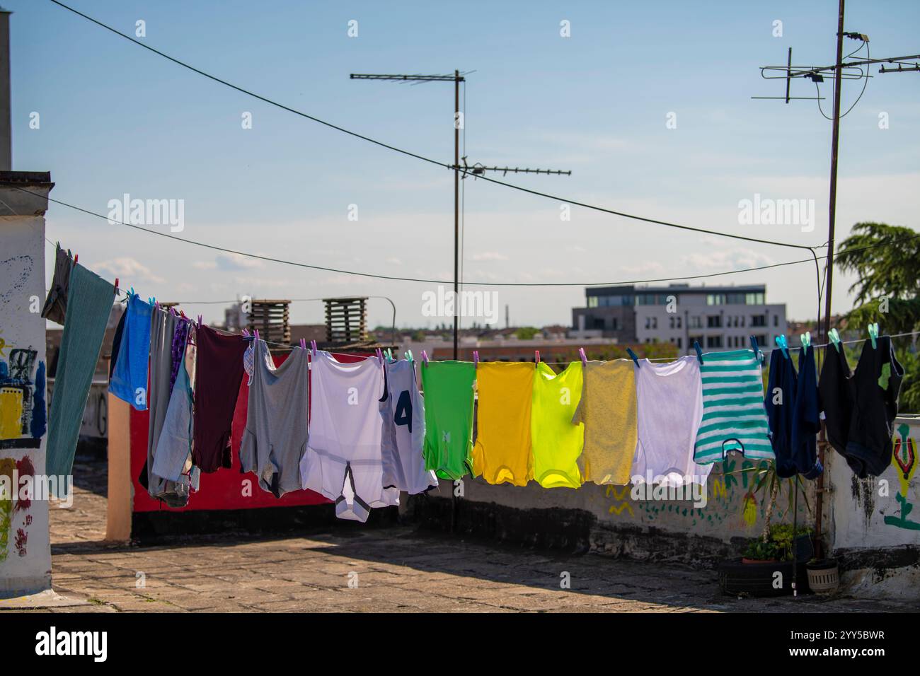 Colorful laundry hanging on clothes rope or string on flat rooftop of ...
