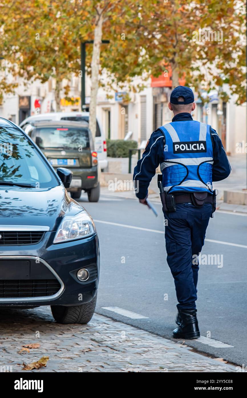 Police officer on duty on a city center street during special event ...