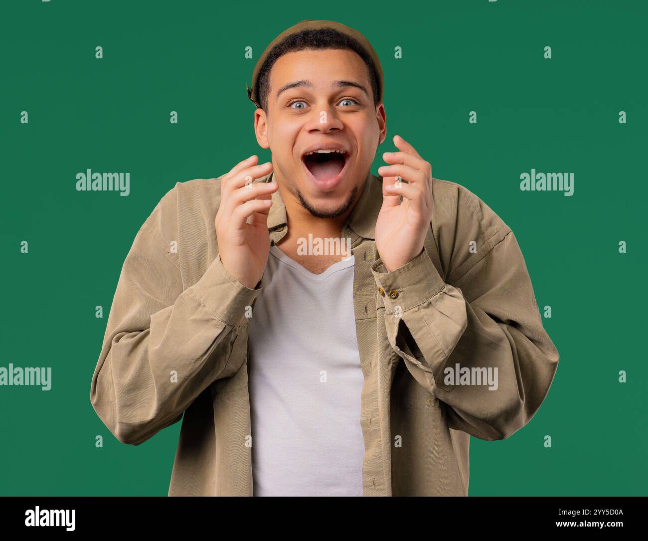 Shocked african american man glad, screaming WOW. Impressed guy ...