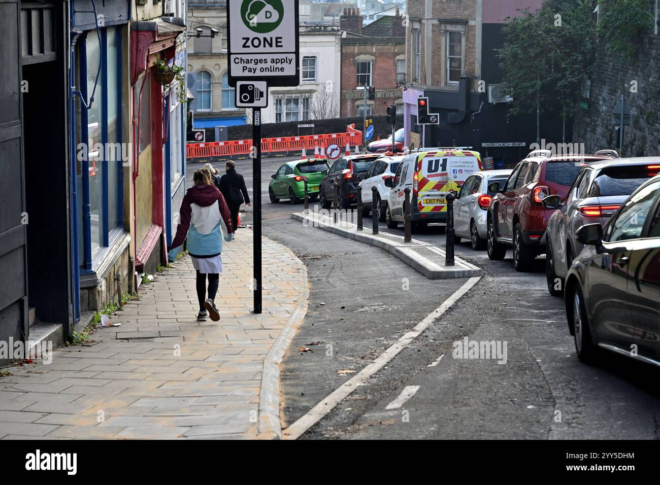 Bike lane separated from traffic with bollards and concrete kerb and ...