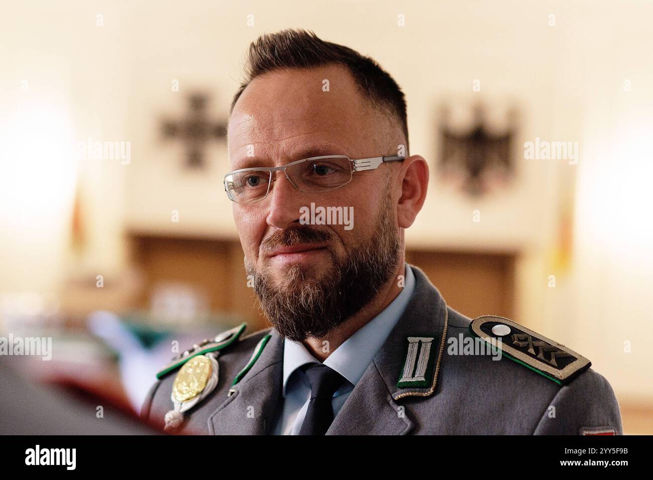 Strausberg, Germany. 18th Dec, 2024. The recipient of the Cross of Honor, Sergeant Major Jan ...