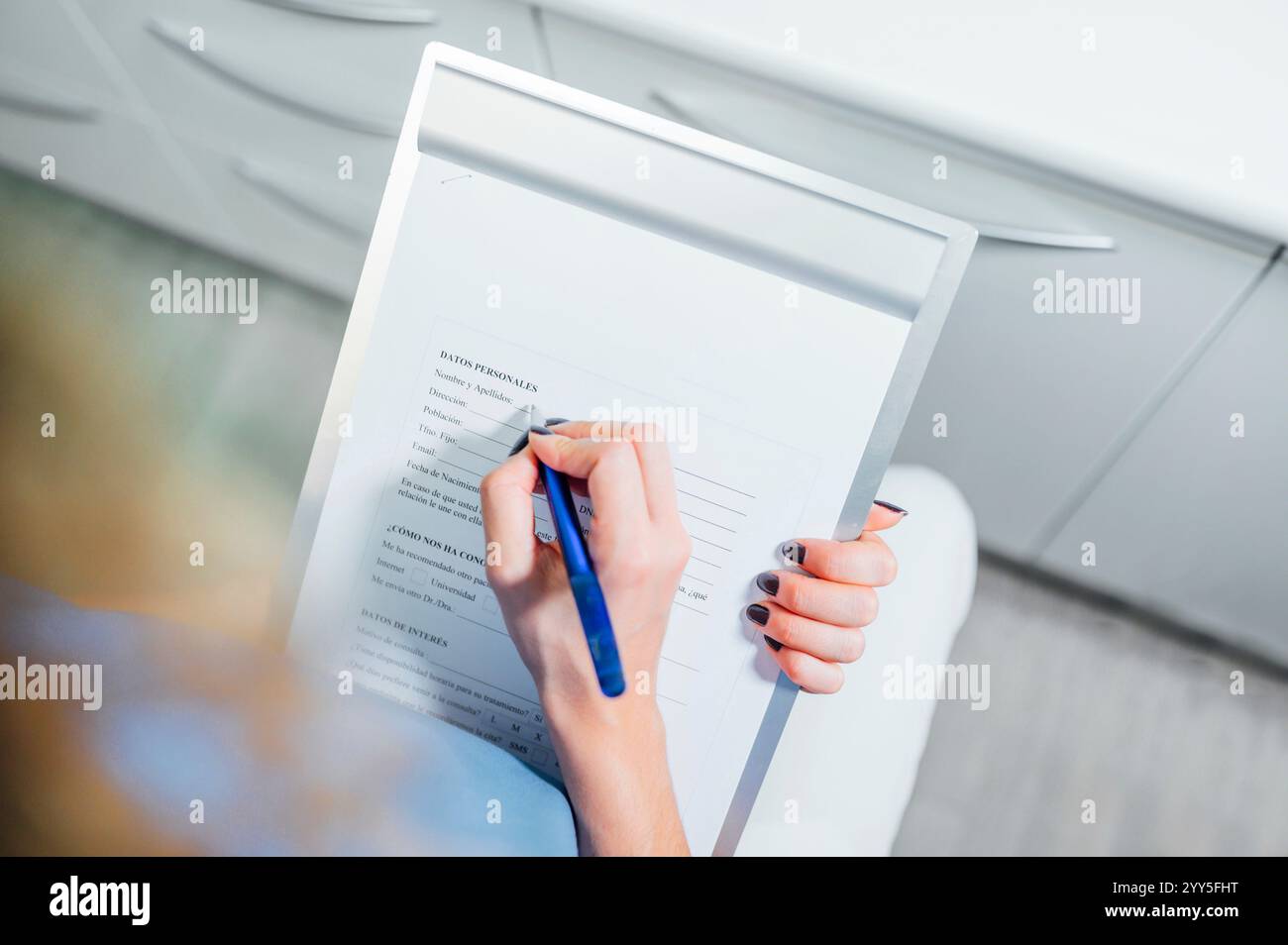 Doctor talking patient filling in hi-res stock photography and images ...
