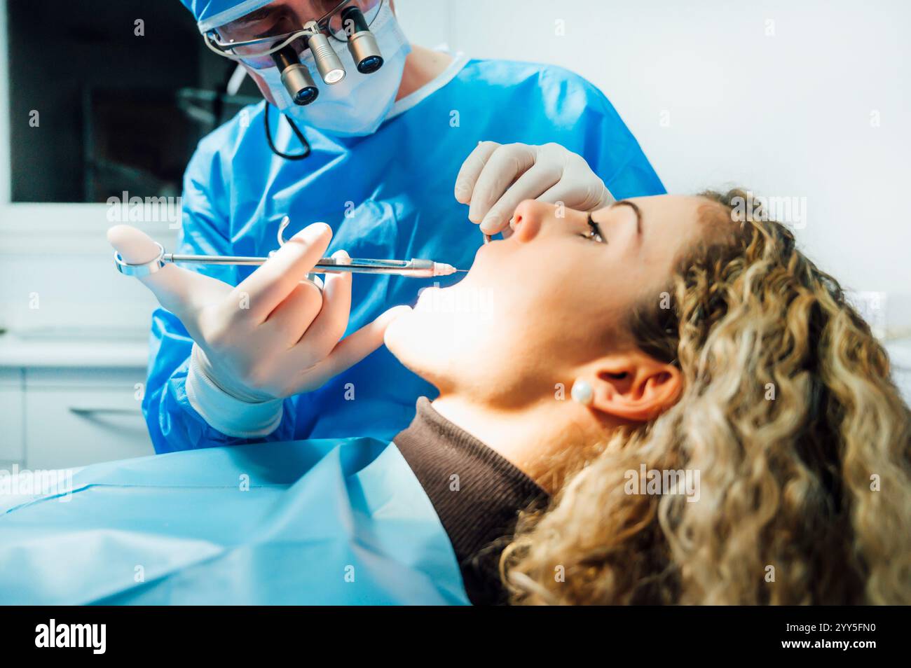 Dentist anesthetizing patient´s mouth during a real endodontics dental ...