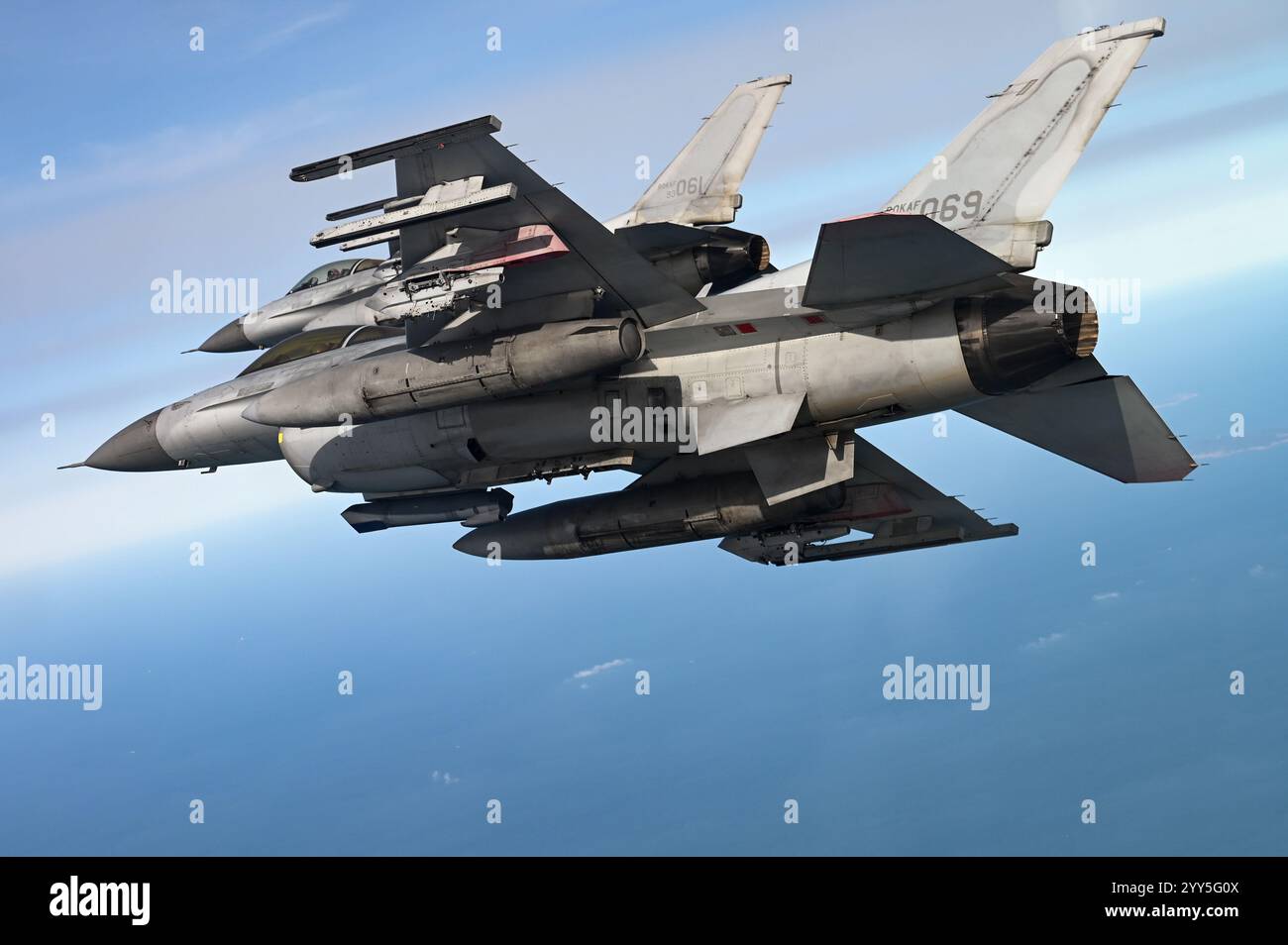 Two Republic of Korea Air Force KF-16 Fighting Falcon aircraft fly in ...