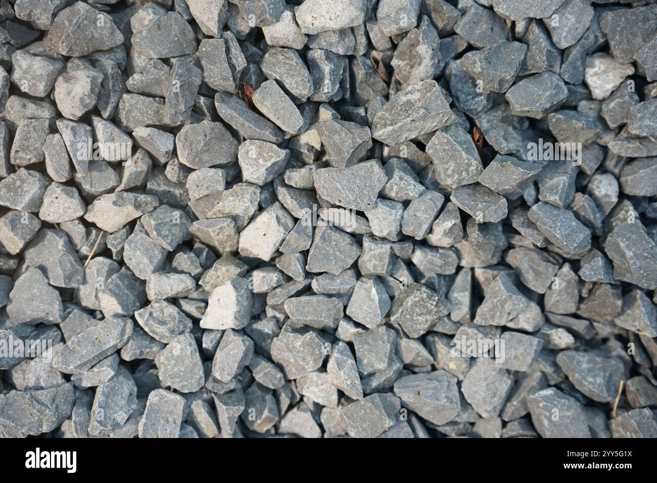 Natural gray pebbles background with various shapes Stock Photo - Alamy