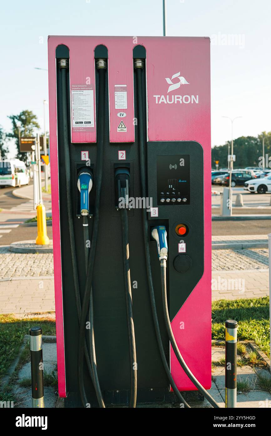 BALICE, KRAKOW, POLAND, SEPTEMBER 15, 2023: Flags Poland against blue ...