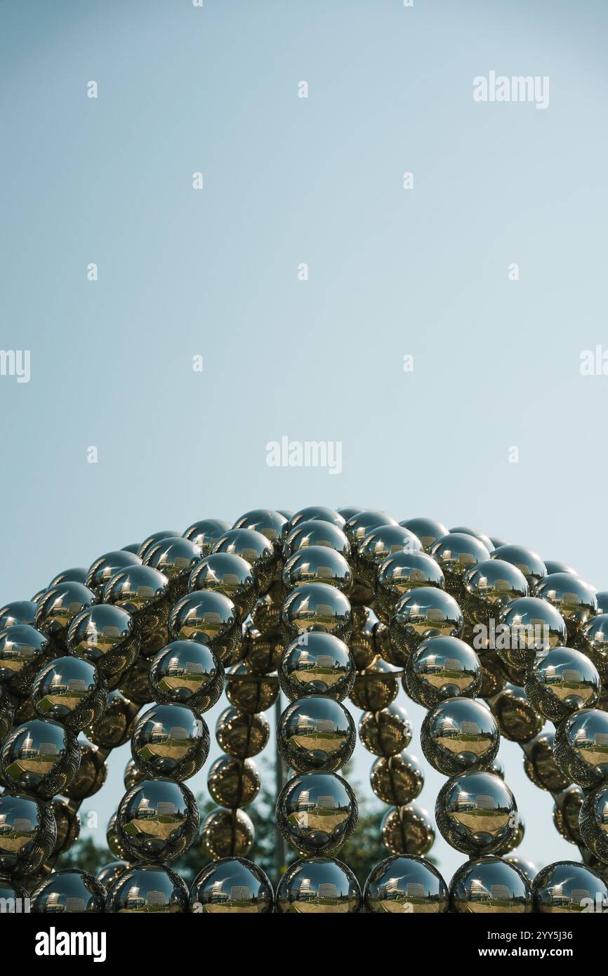 Abstract Metal Reflected Chrome Spheres sculpture,on blue sky, copy ...