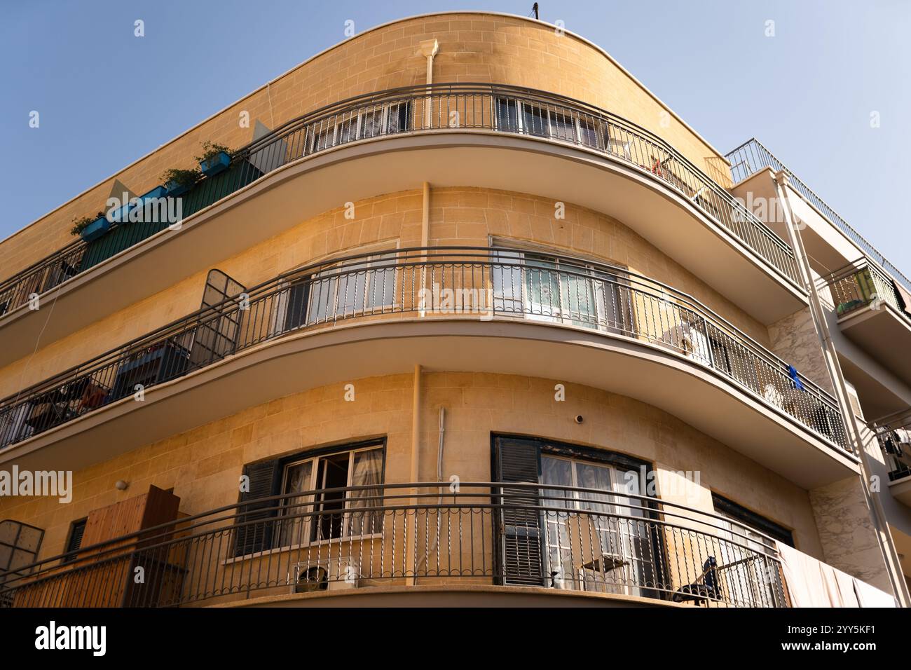 Cute and bohemian blue old balconies facade,wood windows in resident ...