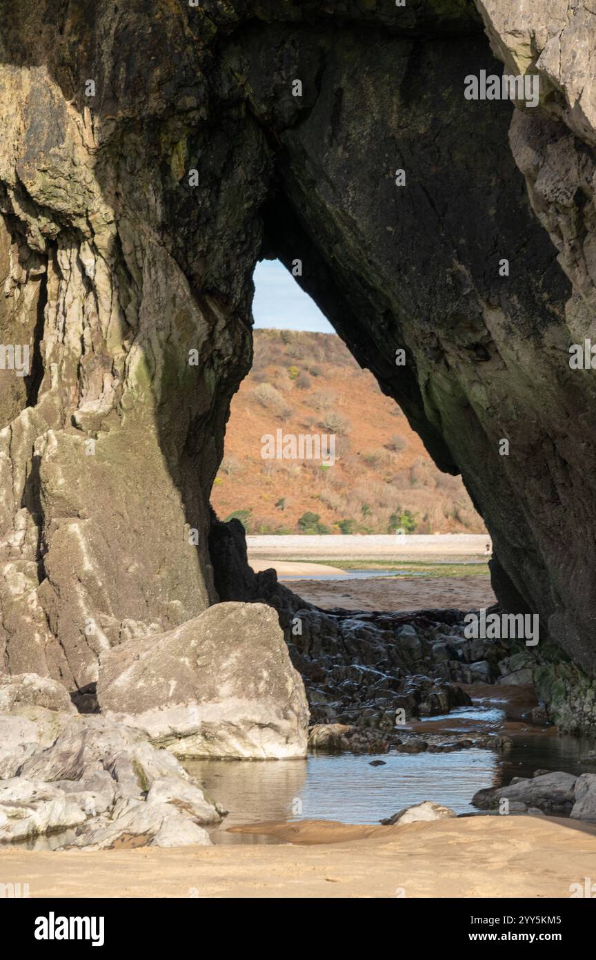 Arch in Three Cliffs, THree Cliffs Bay, Gower, Wales, UK Stock Photo ...