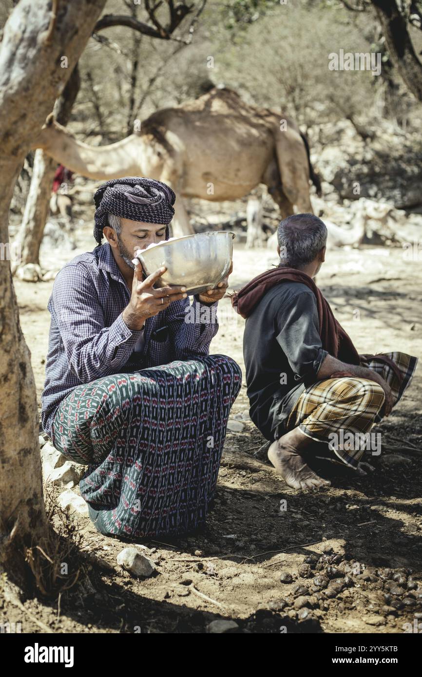 Ali drinks the fresh camel milk with his neighbour Said Barfol, Sheikh ...