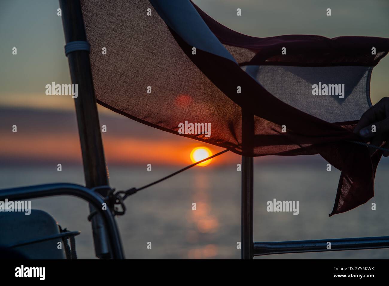 Sunset Through the Sail Stock Photo - Alamy