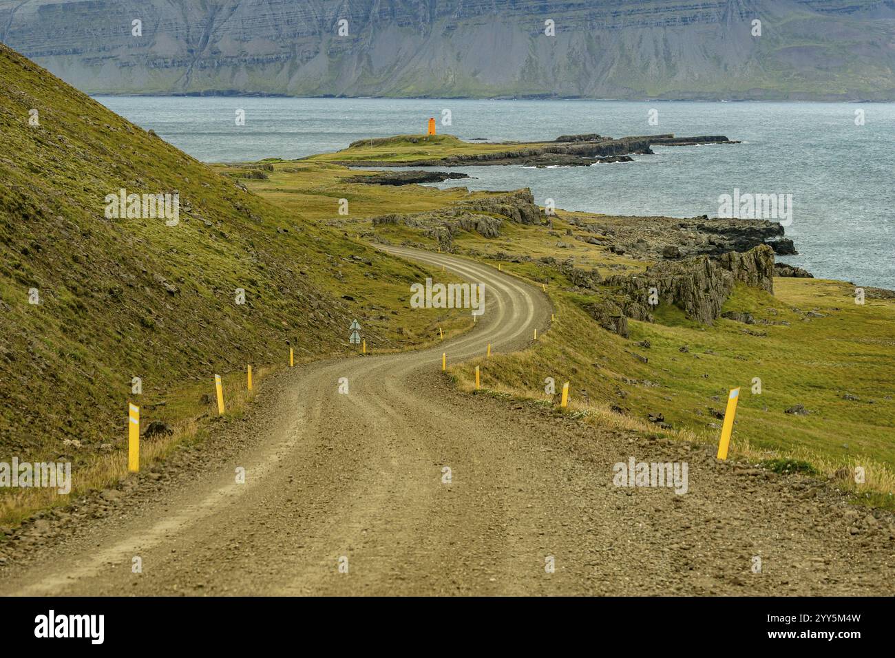 Road 955 with lighthouse Vattarnes at the beginning of ReyÃ°arfjoerÃ°ur ...