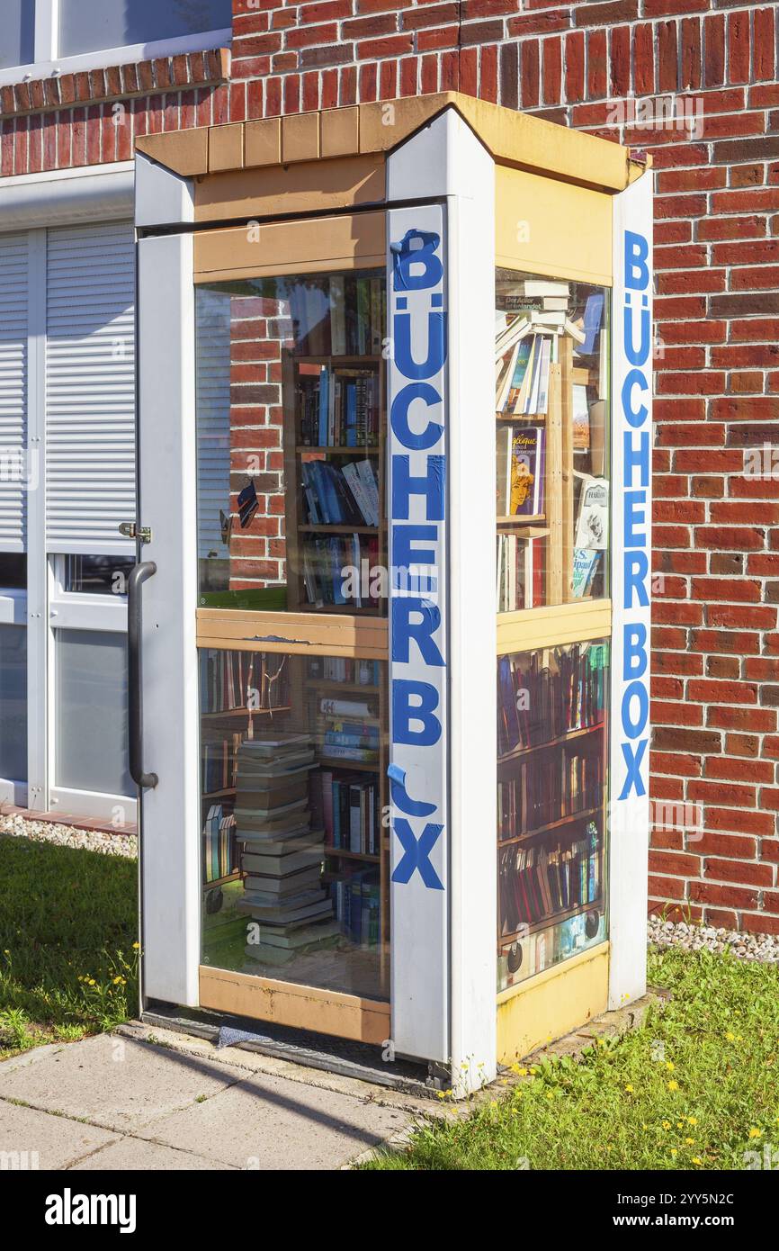 Old public telephone box converted into a swap book or book box ...
