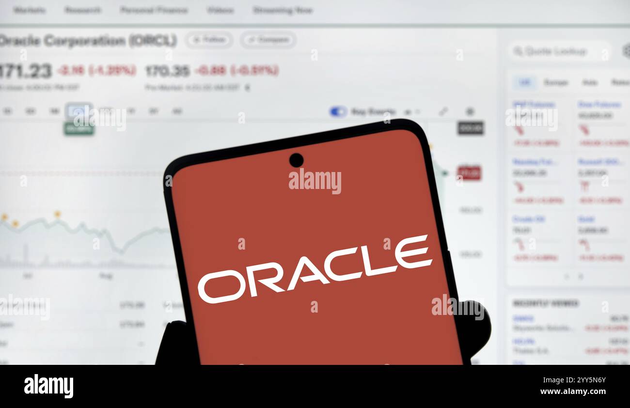 Oracle logo is diaplayed on smartphone. Oracle Corporation is an ...
