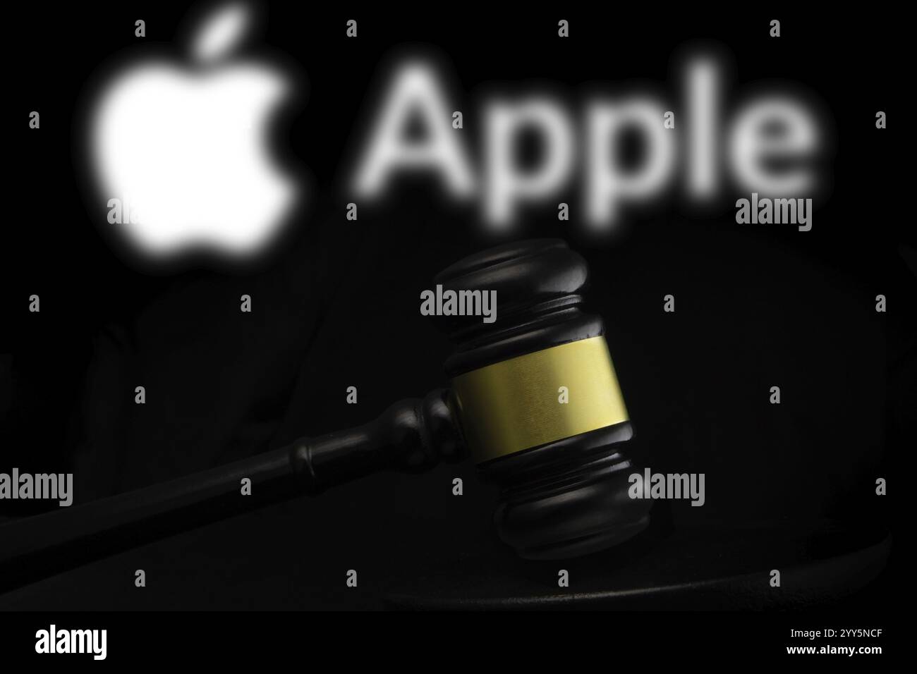 Court gavel in front of the Apple logo. Apple Inc is an American ...
