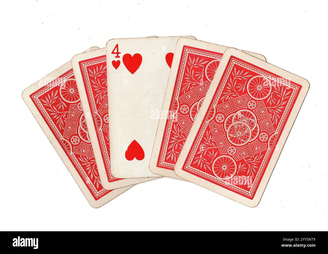 A hand of vintage playing card backs with the four of hearts revealed ...