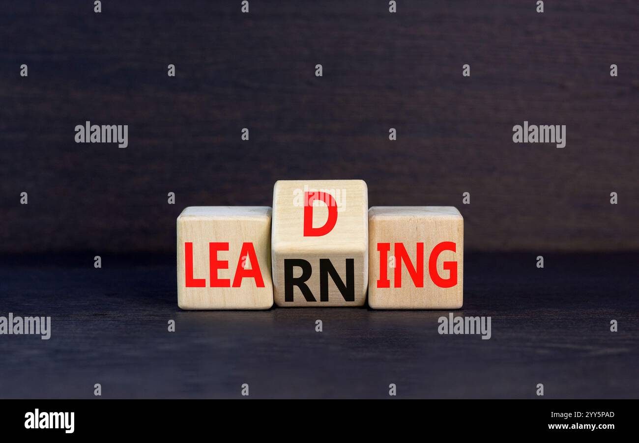 Learning or leading symbol. Concept words Learning Leading on wooden ...