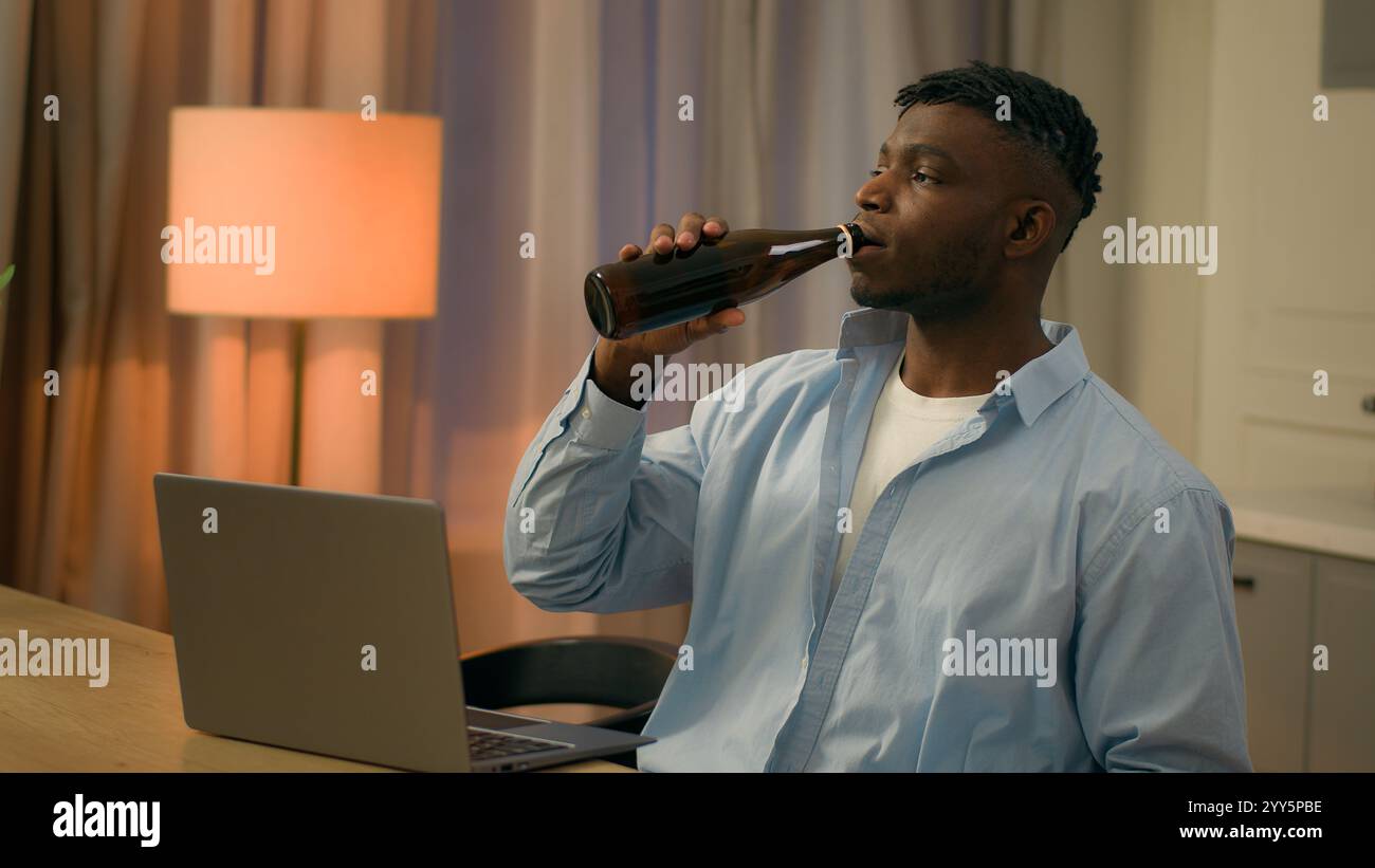 African American man at kitchen male relaxing video call online conference guy alcohol addiction ...