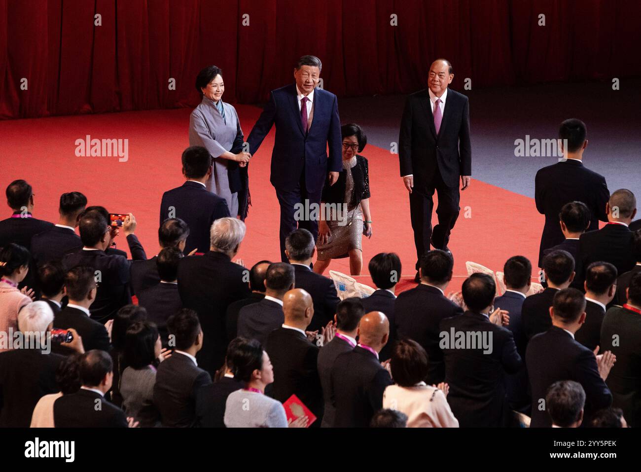 China's President Xi Jinping, background, center arrives with his wife ...