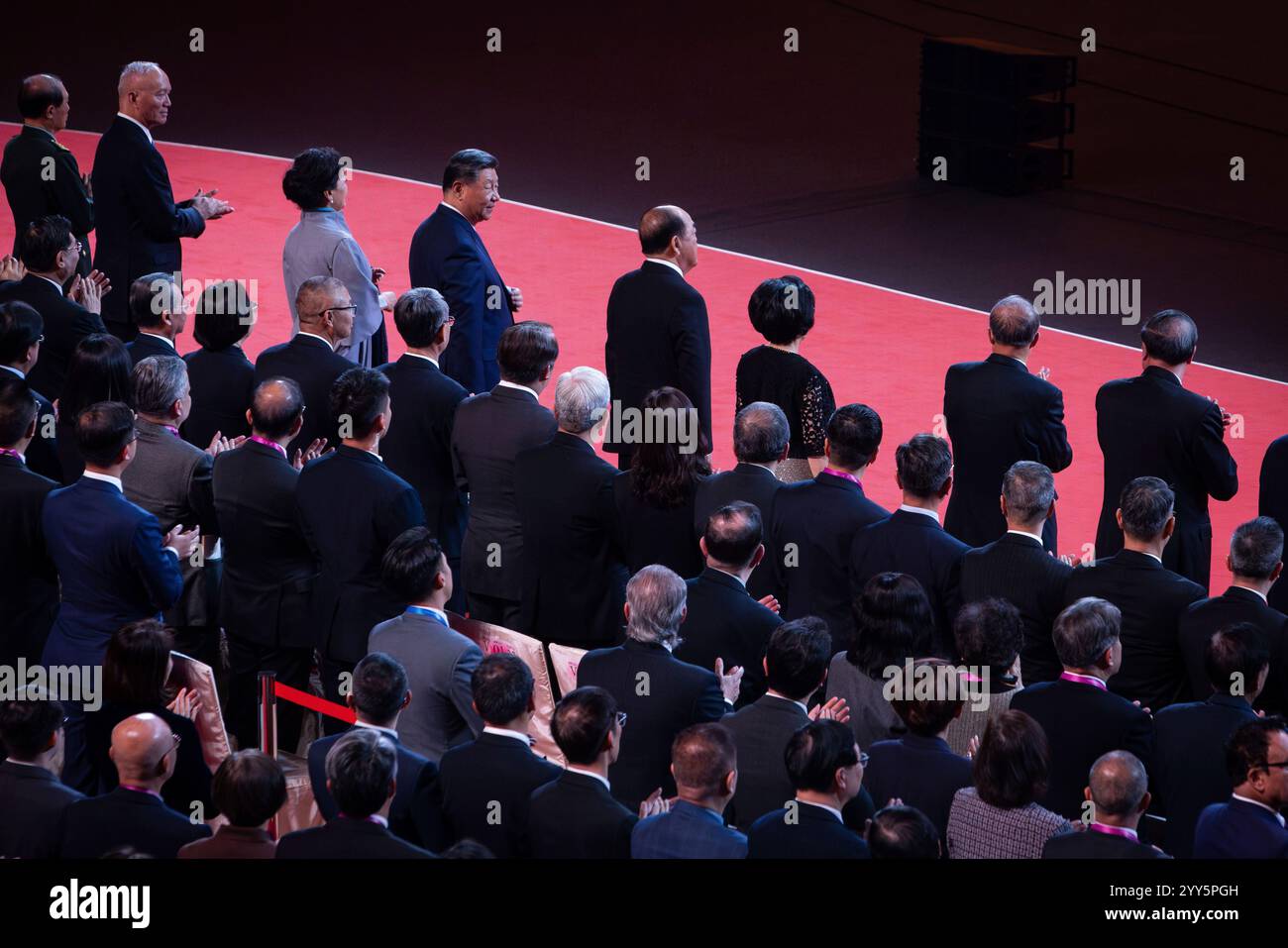 China's President Xi Jinping, background, center left, arrives with his ...
