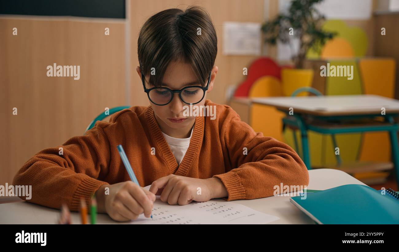 Caucasian guy boy think find idea ponder difficult task writing notes ...