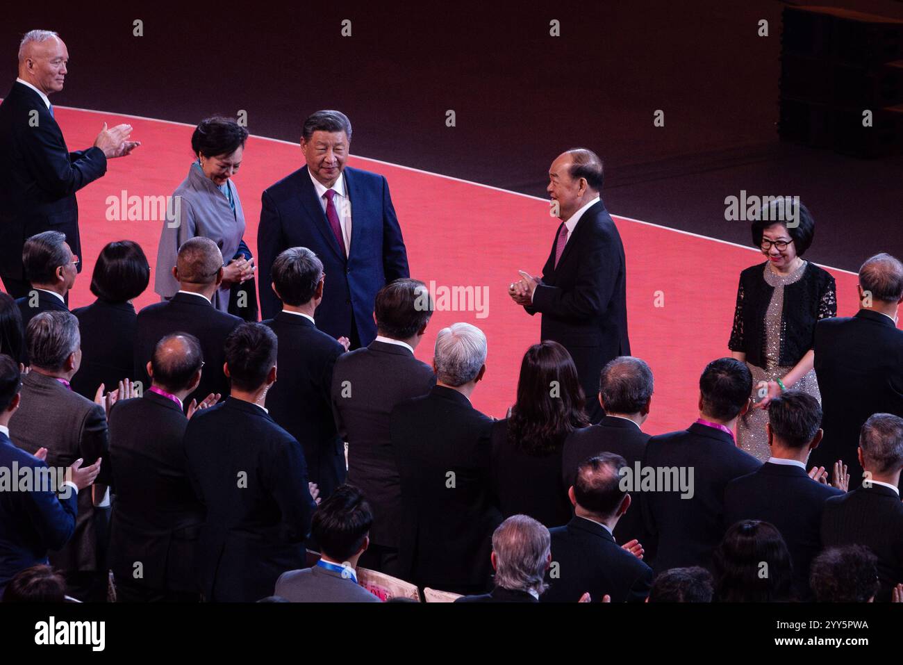 China's President Xi Jinping, background, third left arrives with his ...