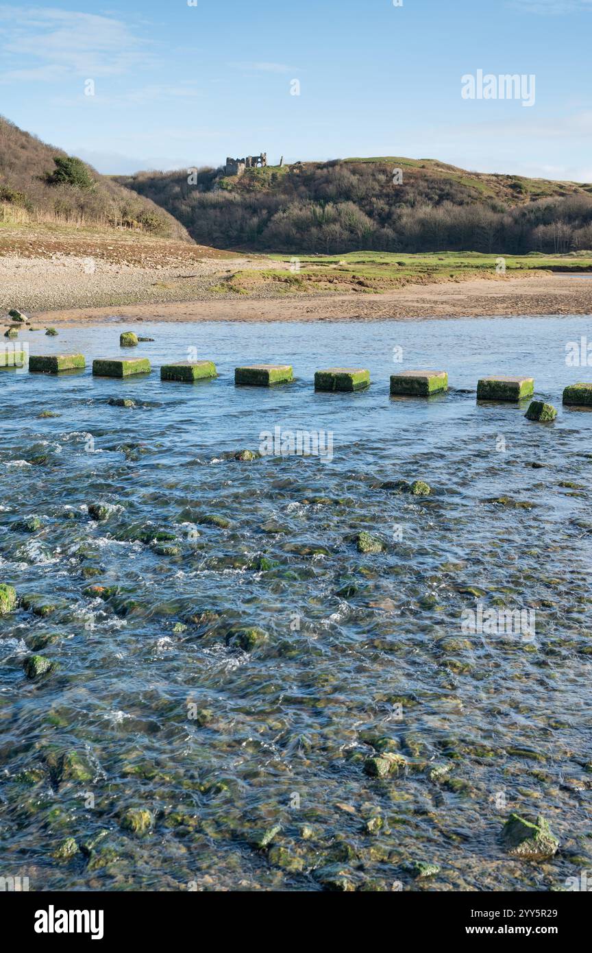 Stepping stones across Pennard Pill, Three Cliffs Bay, Gower, Wales, UK ...