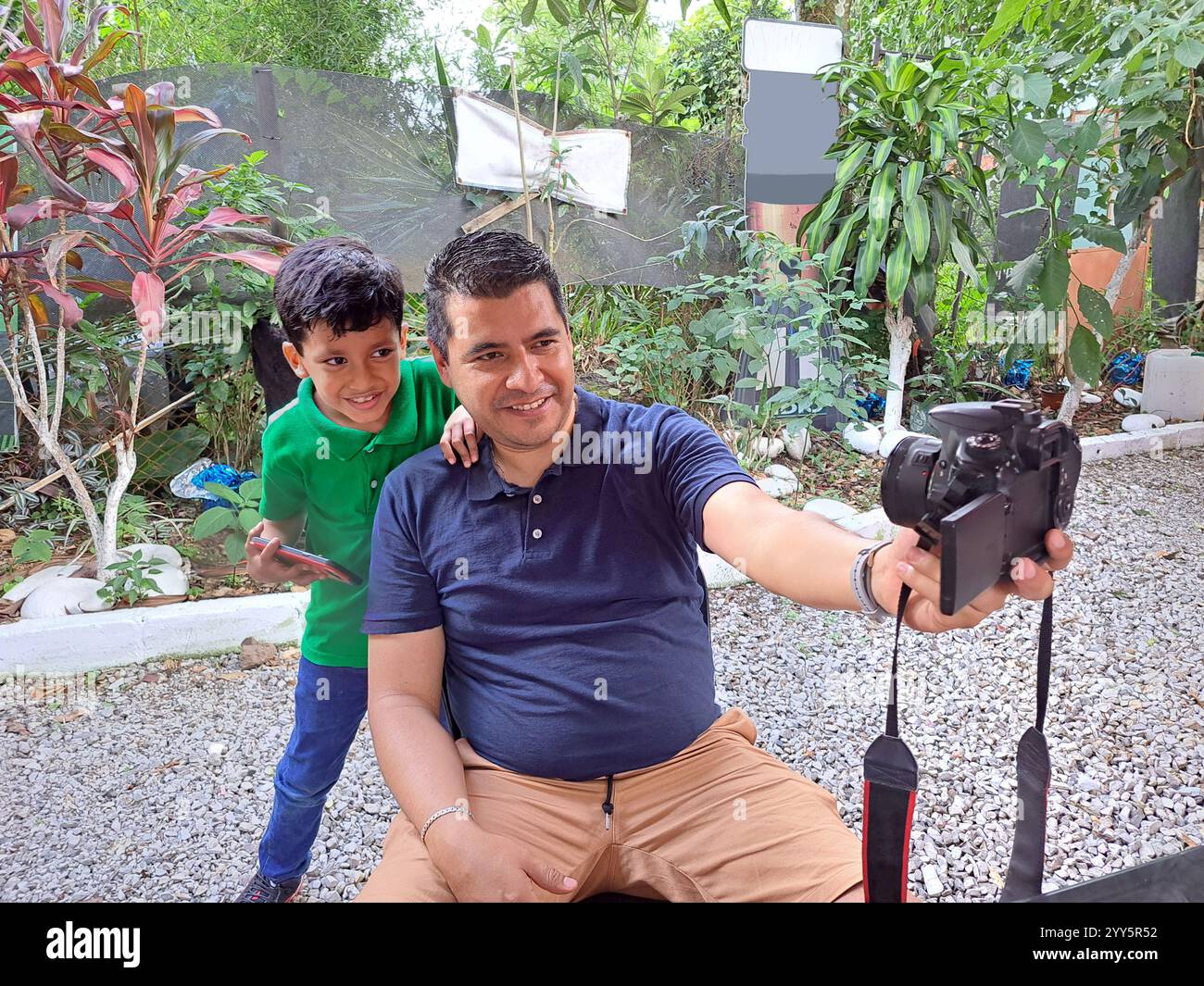 Single dad with his 8-year-old dark-skinned Latino son play with the ...