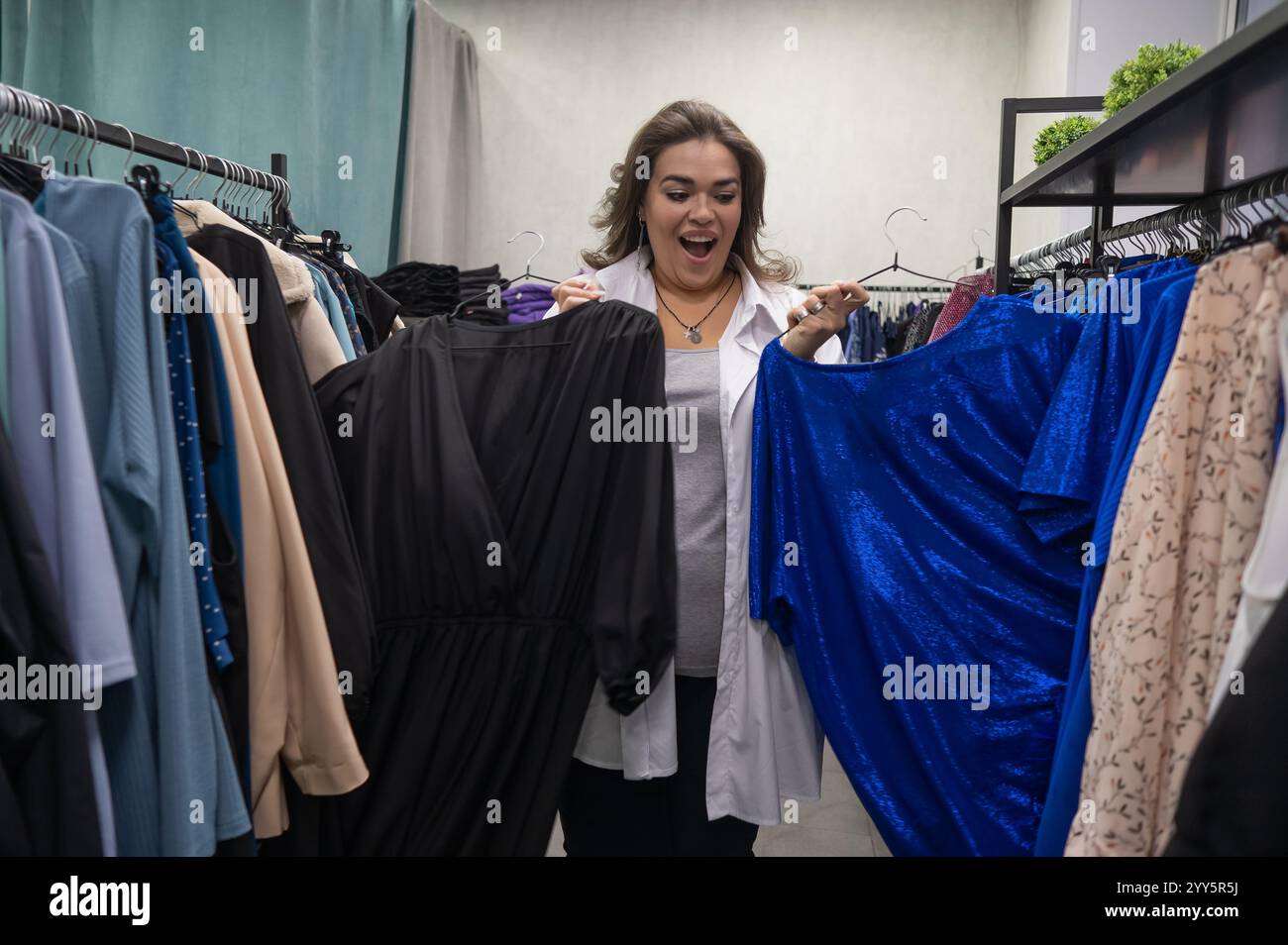 A fat woman chooses clothes in a plus size store Stock Photo - Alamy