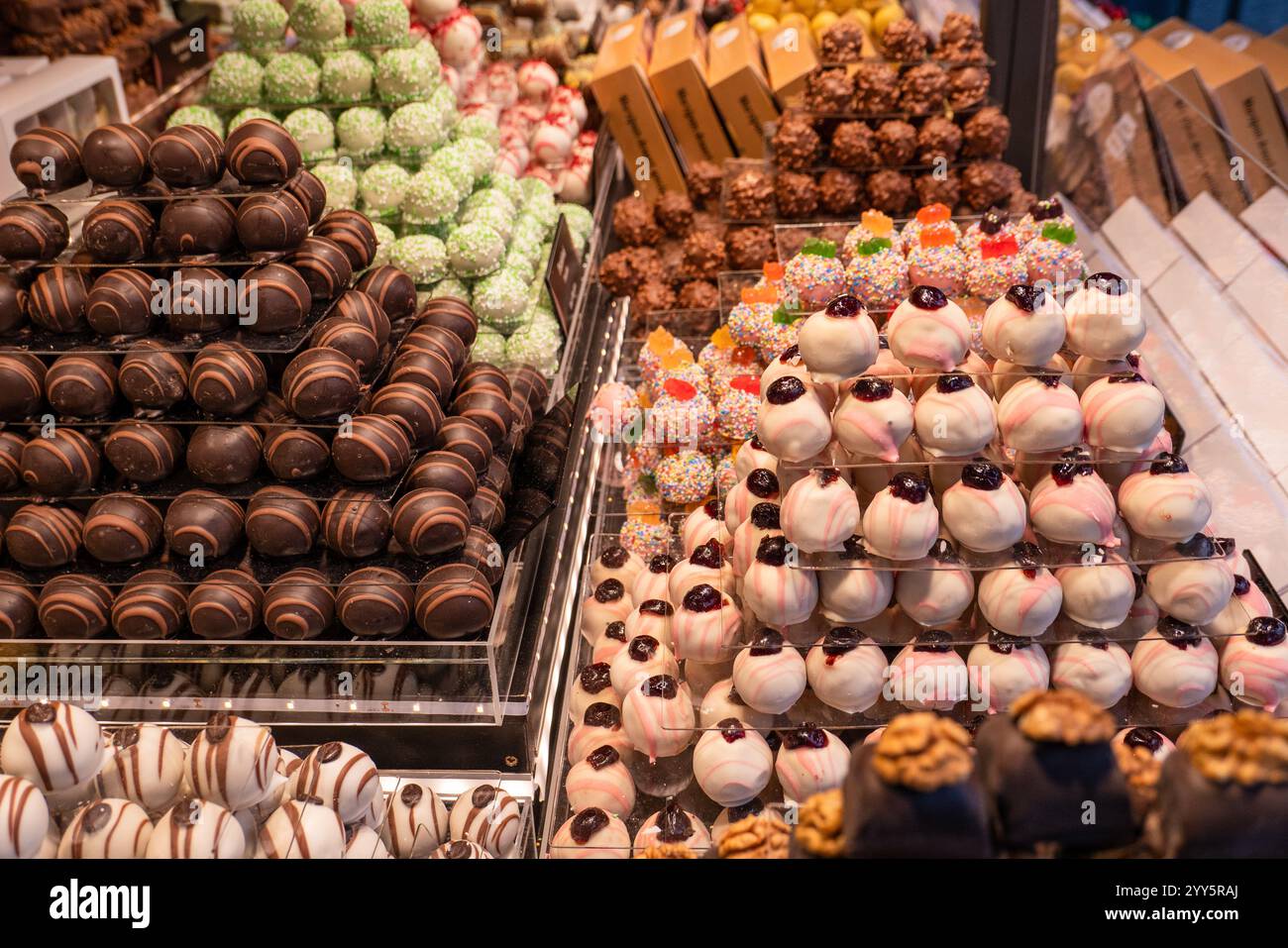 An exquisite display of handmade chocolates and candies in various ...