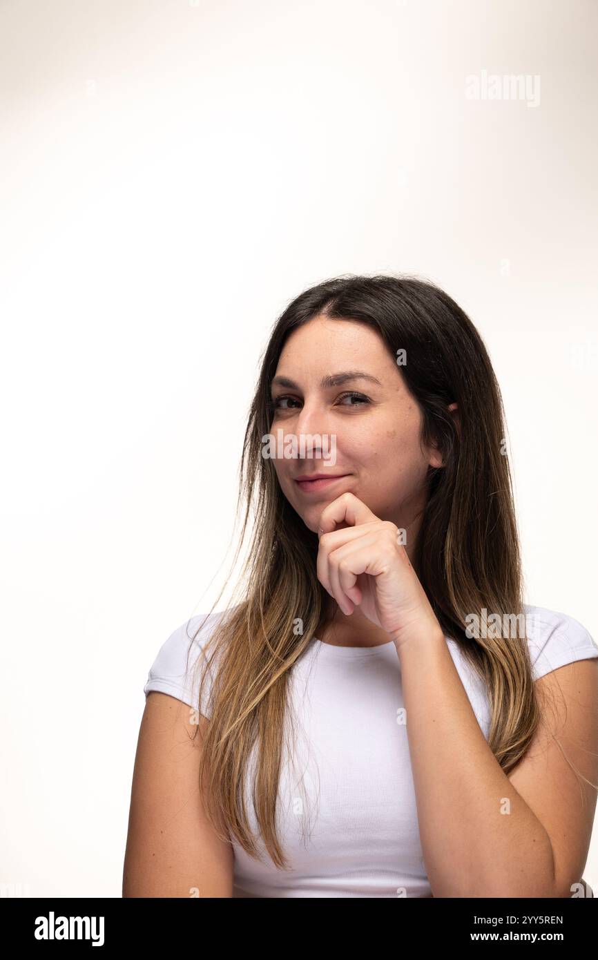 Deep Reflection: Thoughtful Woman on White Background Stock Photo - Alamy