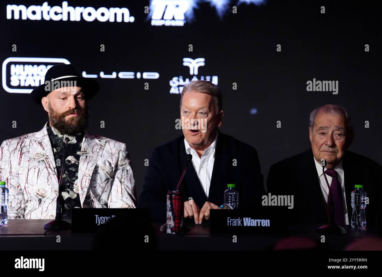Boxer Tyson Fury (left), boxing promoter Frank Warren and Top Rank CEO ...